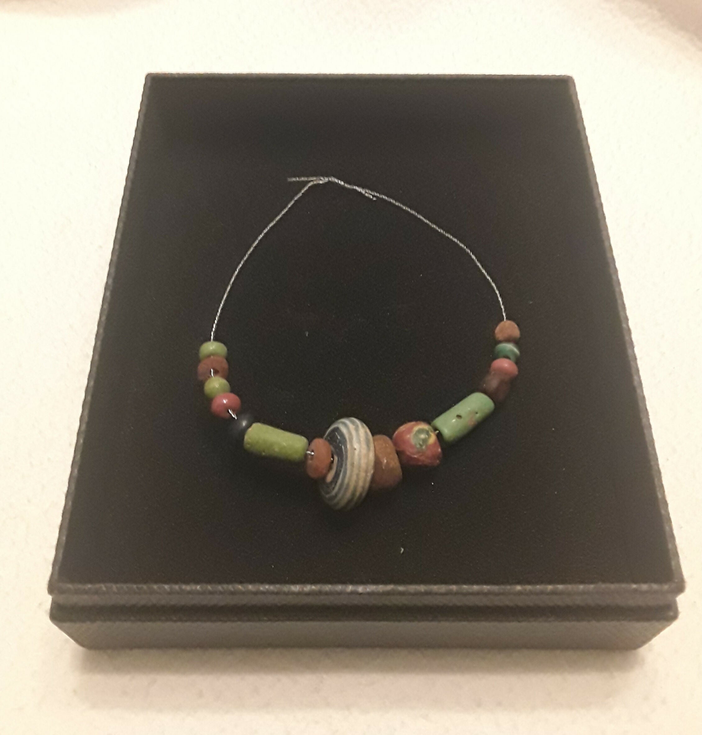 An Anglo Saxon Ladies Restrung Group Of Glass / Amber Beads.