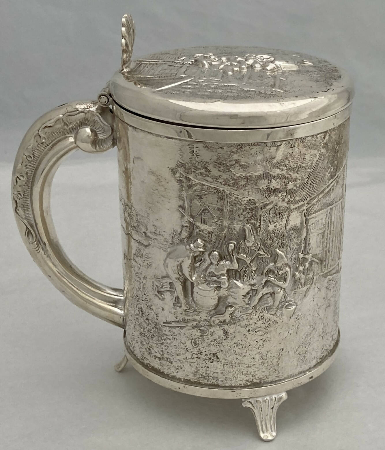 A Northern European Style Silver Plated Lidded Tankard with Relief Det